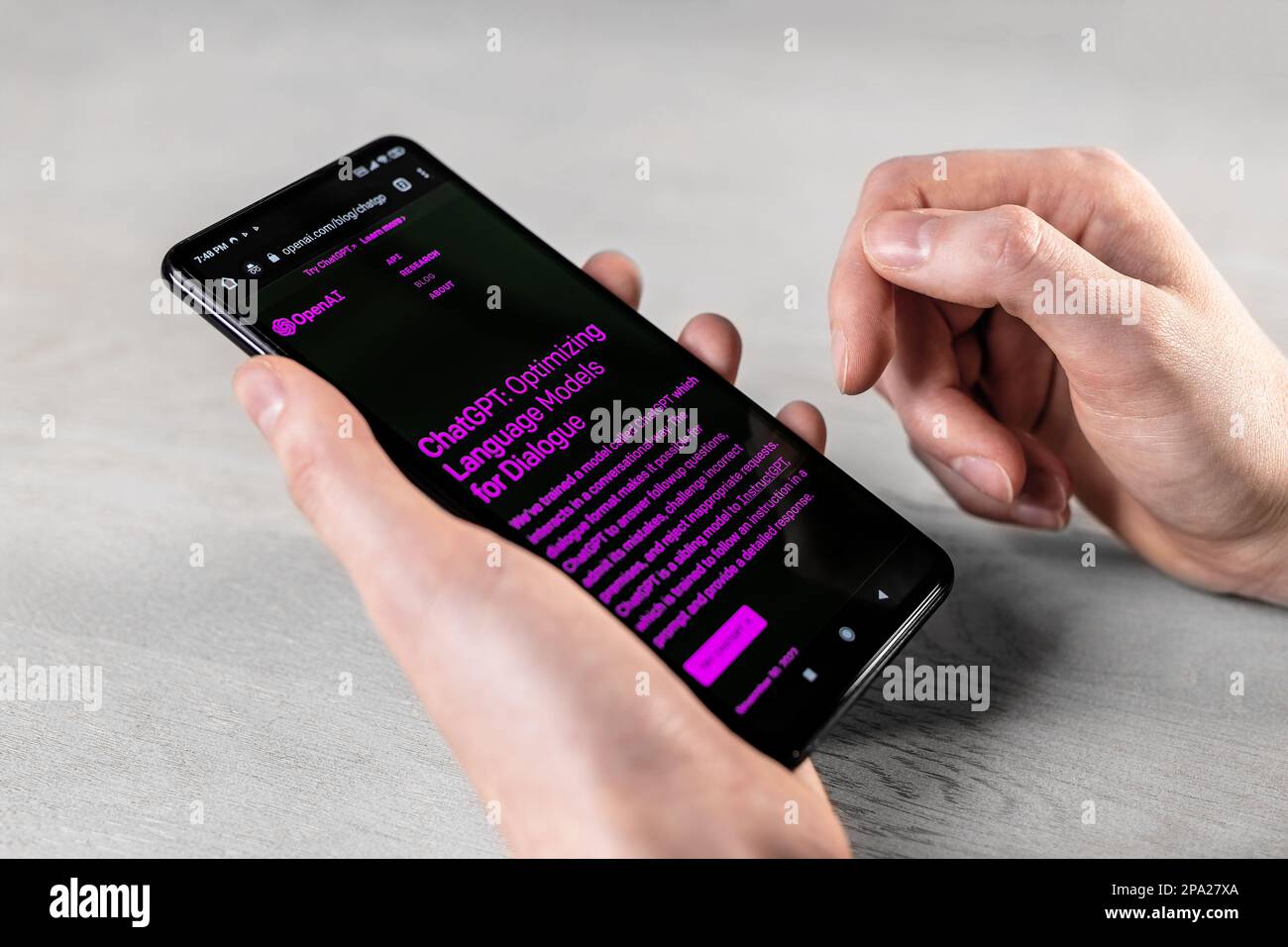 Lodz, Poland March 01 2023 Hands with phone screen, Open AI homepage ...