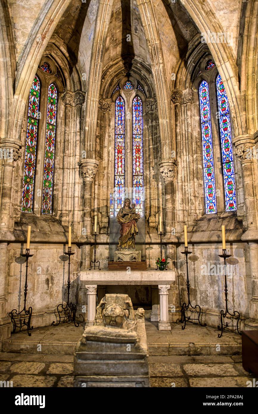 Three stained glass windows in a stone arched chapel. Architecture ...