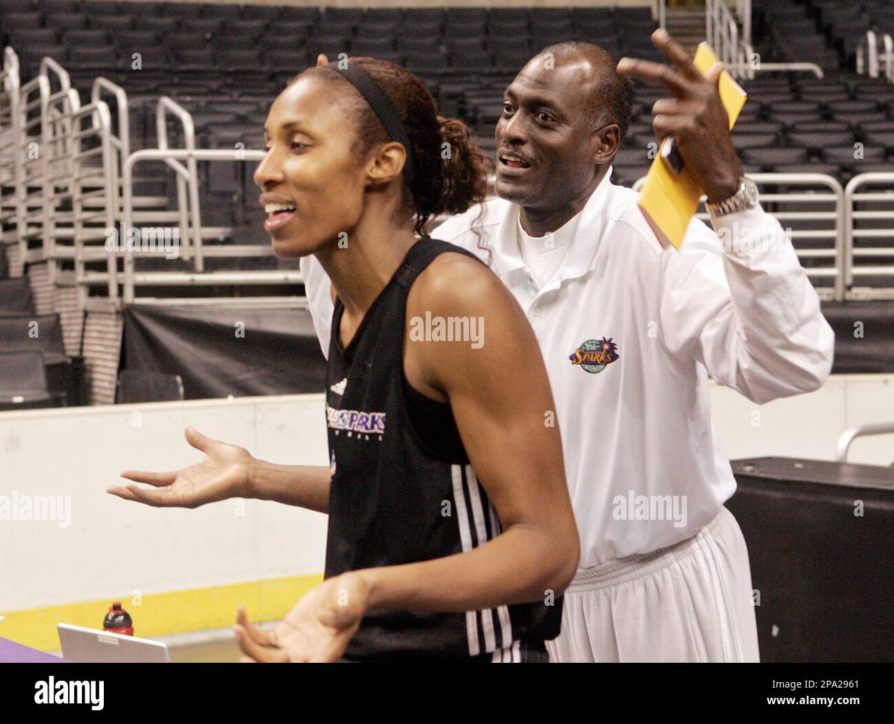 Los Angeles Sparks head coach Michael Cooper, right, mimics center Lisa ...