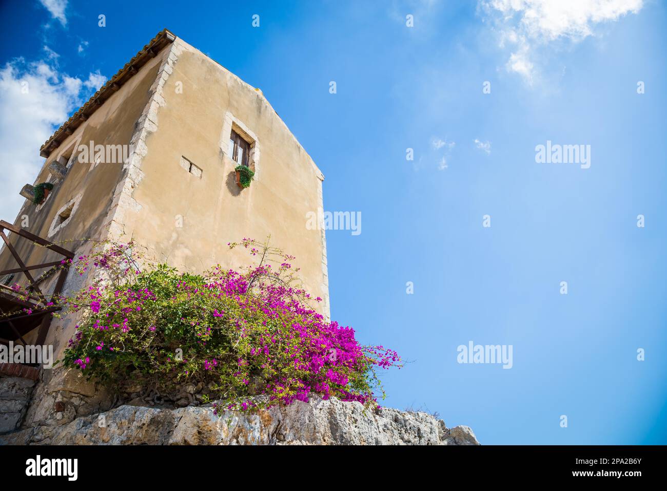 Traditional old Sicilian house during a sunny day with a wonderful blue ...
