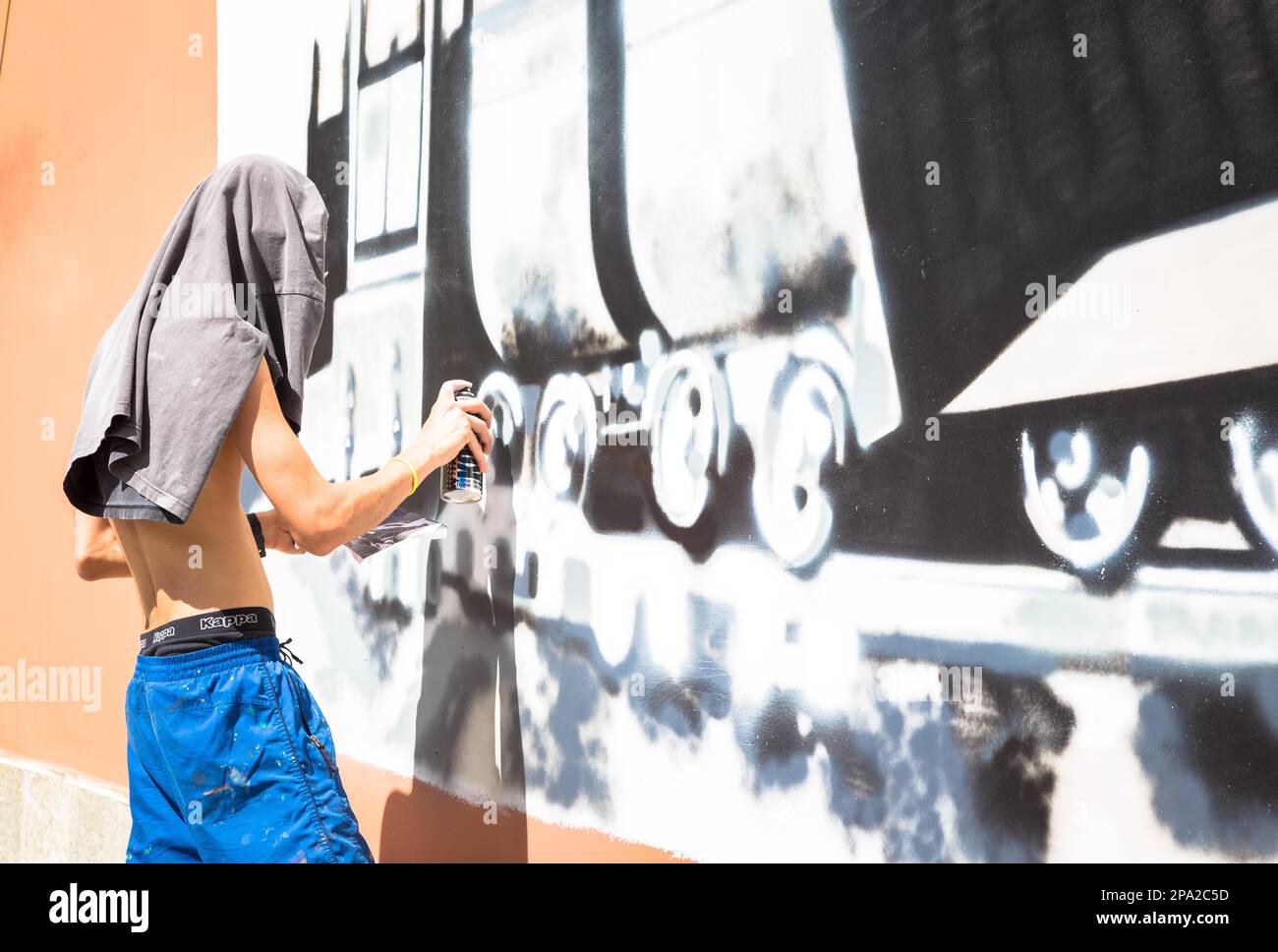 TURIN, ITALY - June 07, 2018: anonymous graffiti artist working on his ...