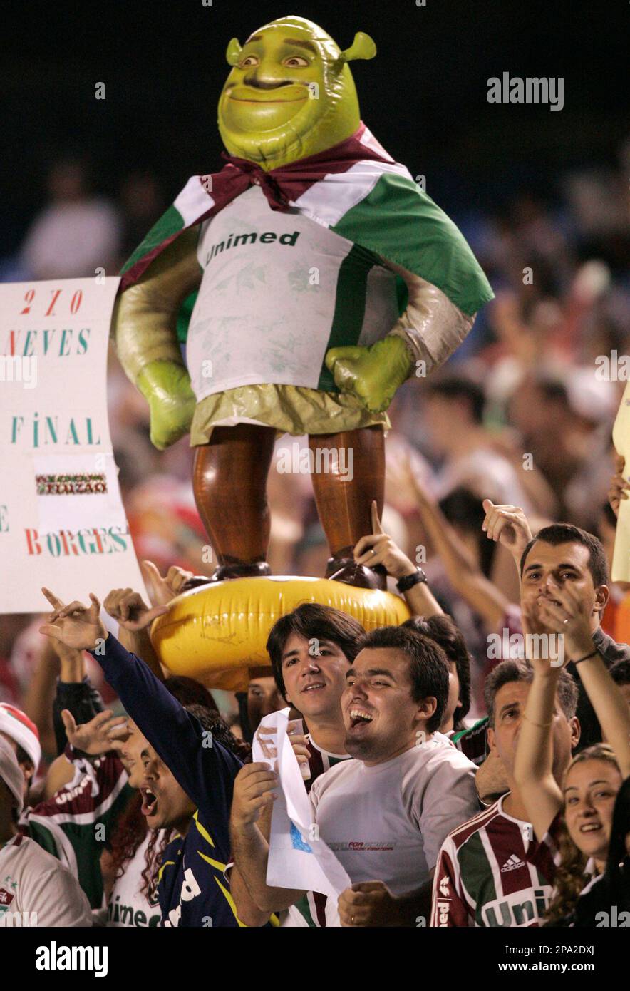 Brazil's Fluminense's fans, holding up a model of the character from ...