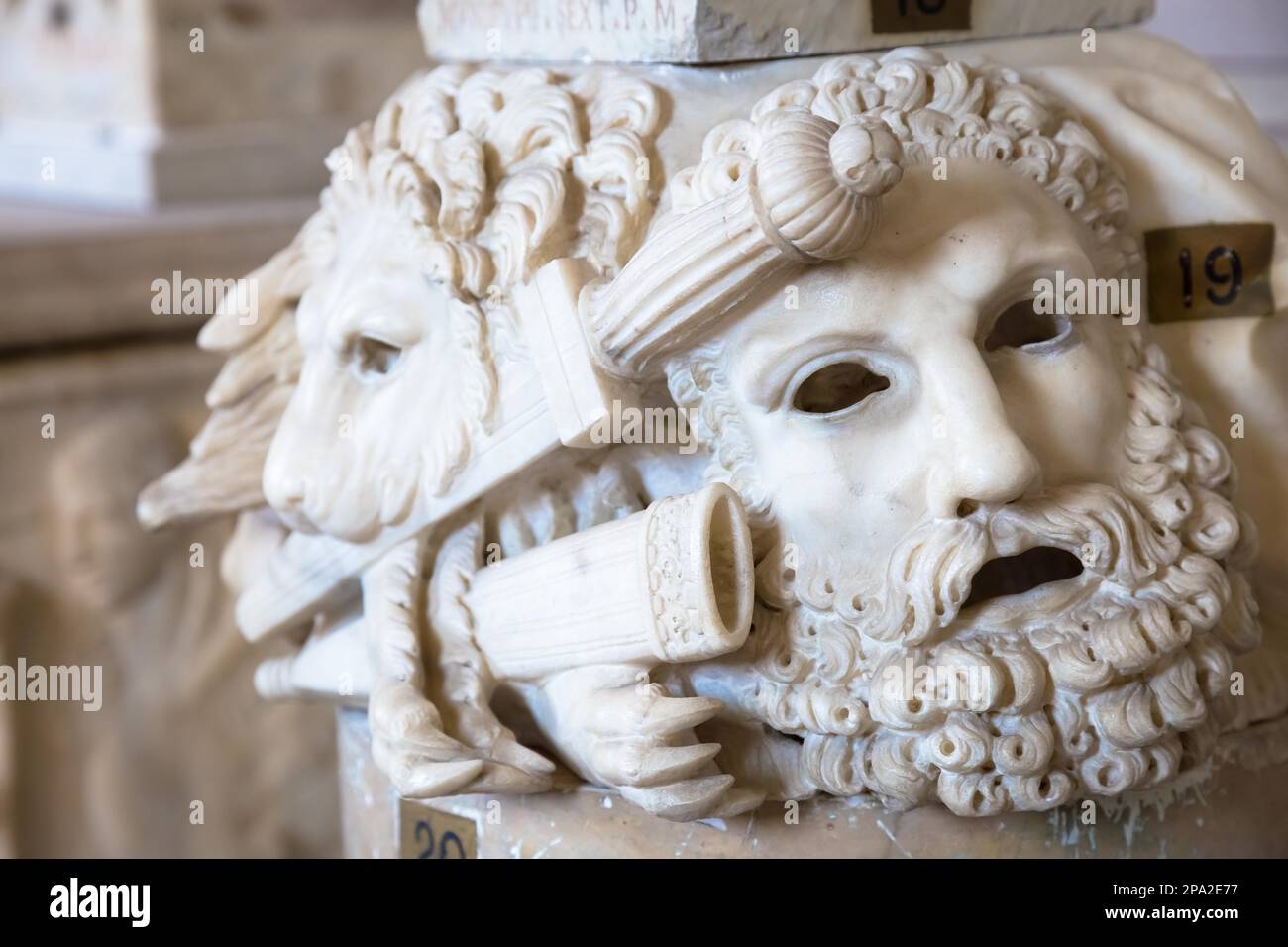 Ancient theatre mask, made of marble, located at the base of a Roman ...