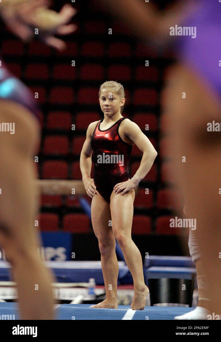 Shawn Johnson waits her turn on the floor routine during practice for ...