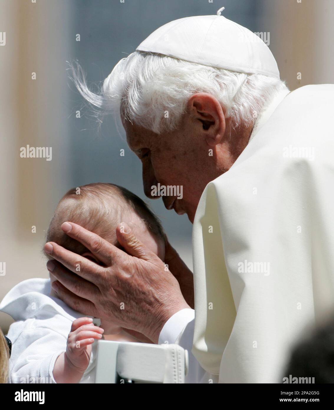 Pope Benedict XVI kisses a baby's head during his weekly general ...