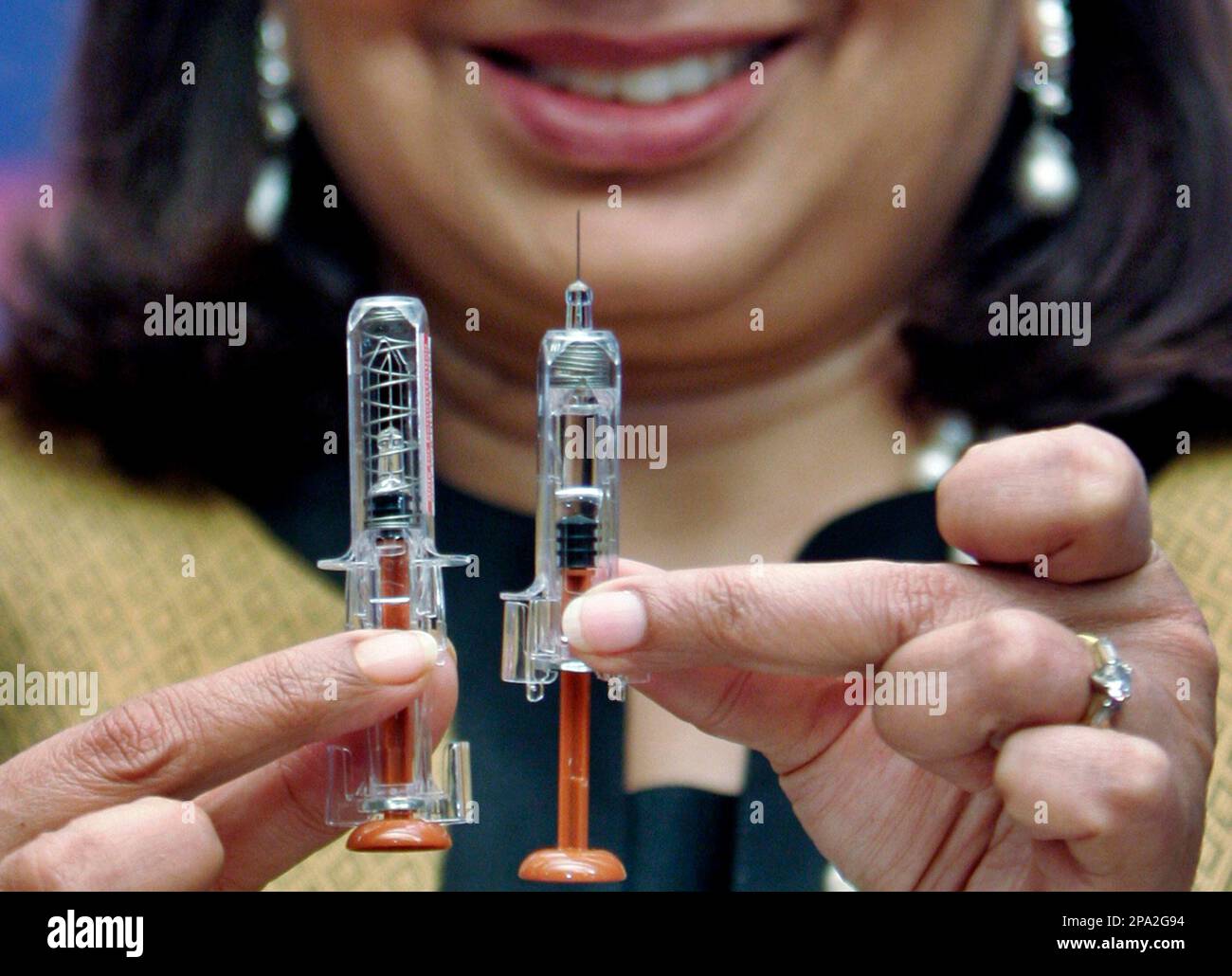 Biocon Ltd. Chairman and Managing Director Kiran Mazumdar Shaw displays ...