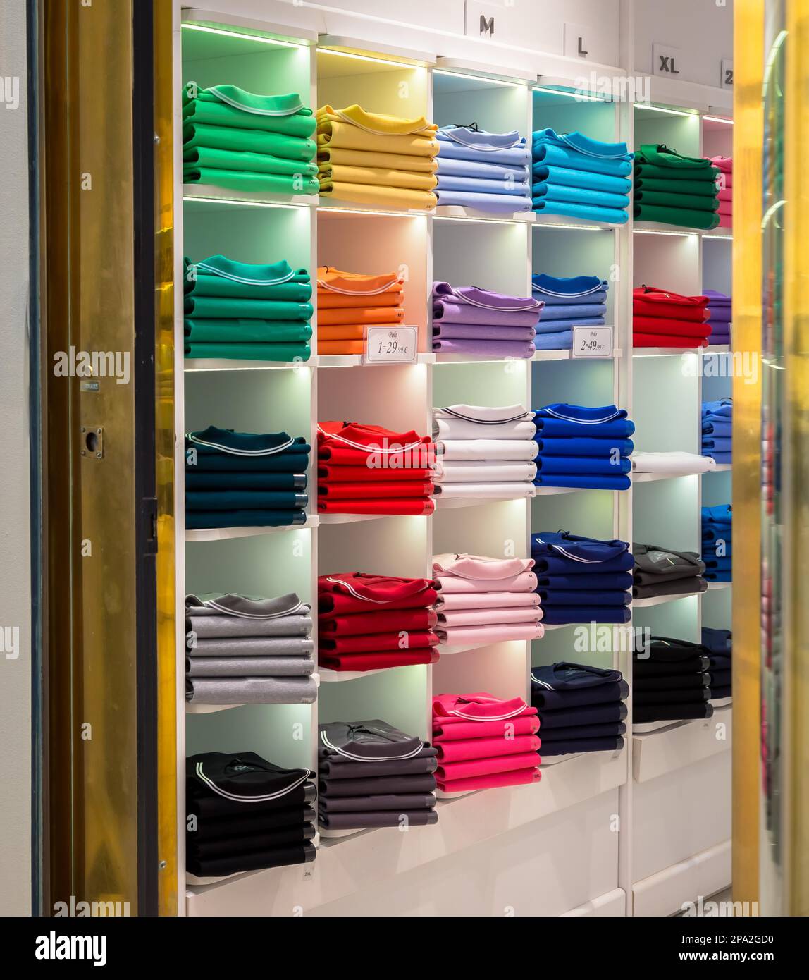 Polo shirt shop interior - fashion store Stock Photo - Alamy