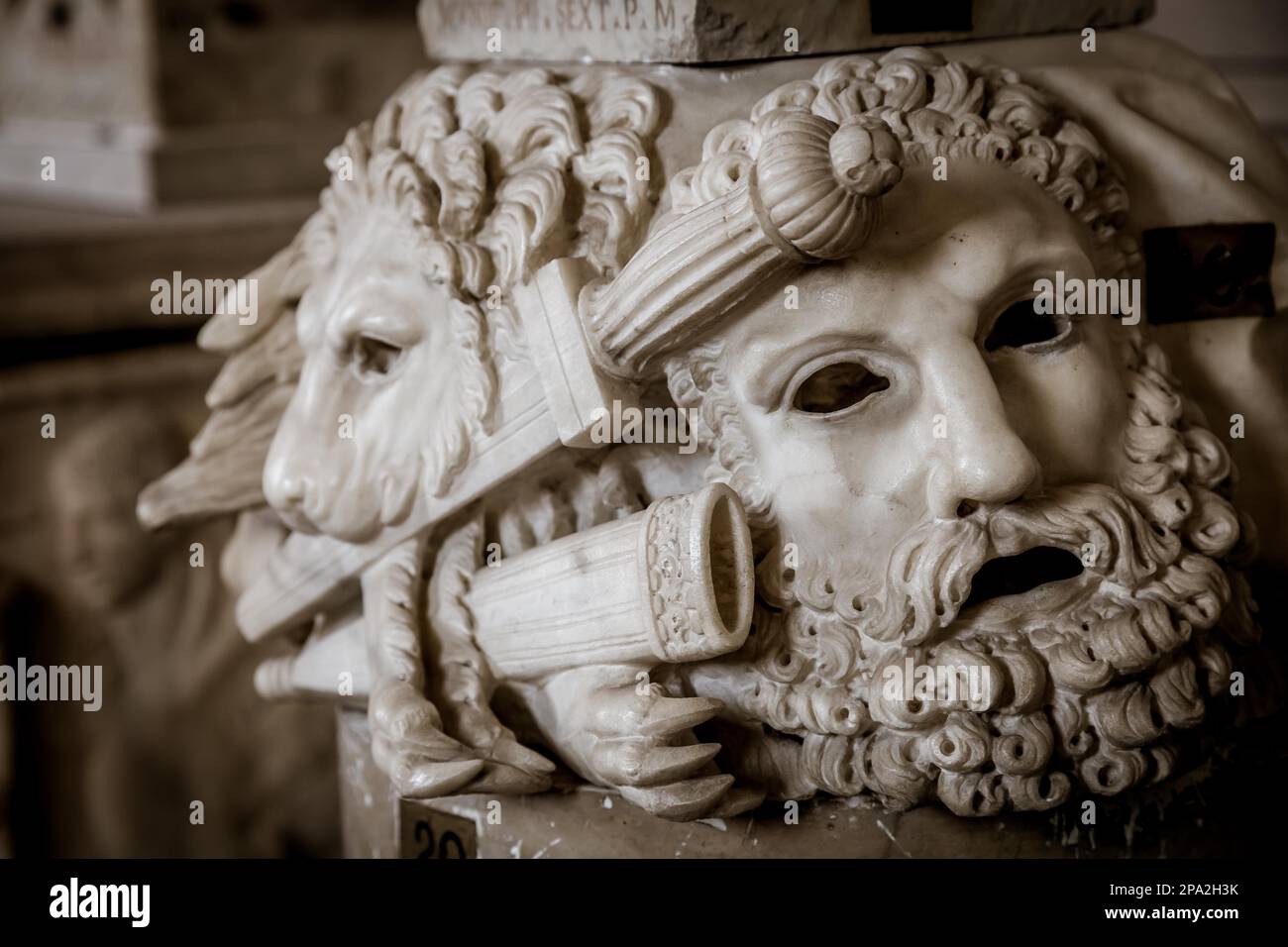 Ancient theatre mask, made of marble, located at the base of a Roman ...