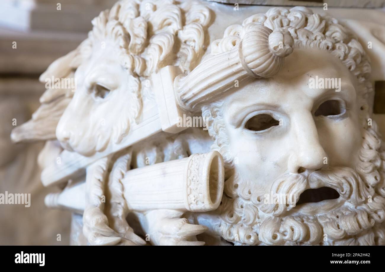 Ancient theatre mask, made of marble, located at the base of a Roman ...