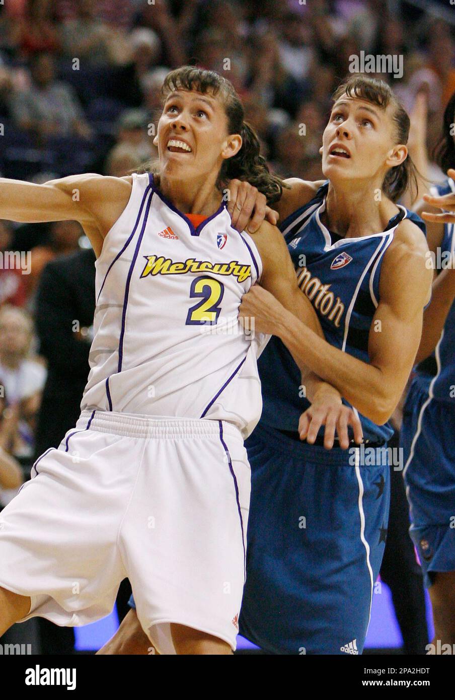 Washington Mystics' Coco Miller, right, battles twin sister and Phoenix ...
