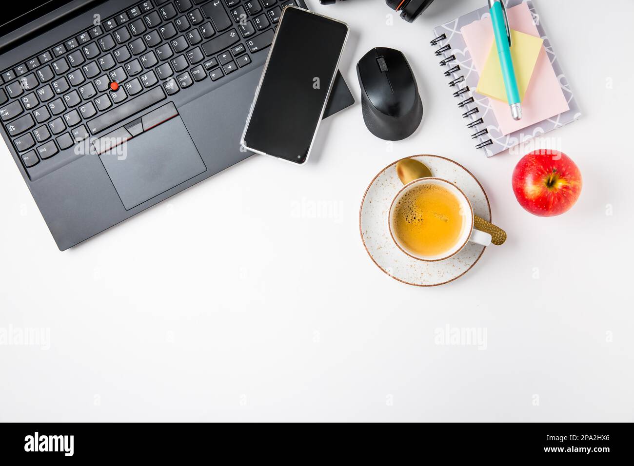 Working place and office desk with coffee, laptop, apple, headset and ...