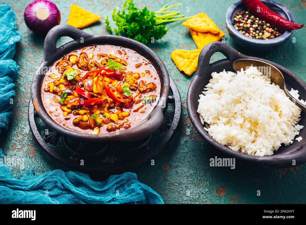 Hot Mexican Chili con carne with rice and tortilla chips and spices ...