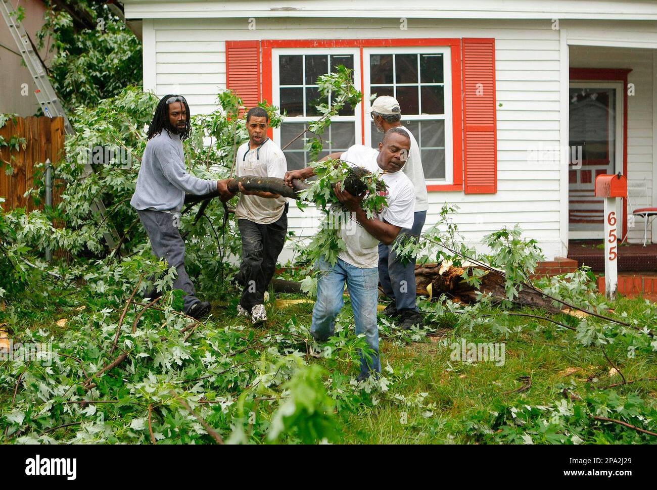 Carl White, front, gets help from friends, from left, Steve Groves ...