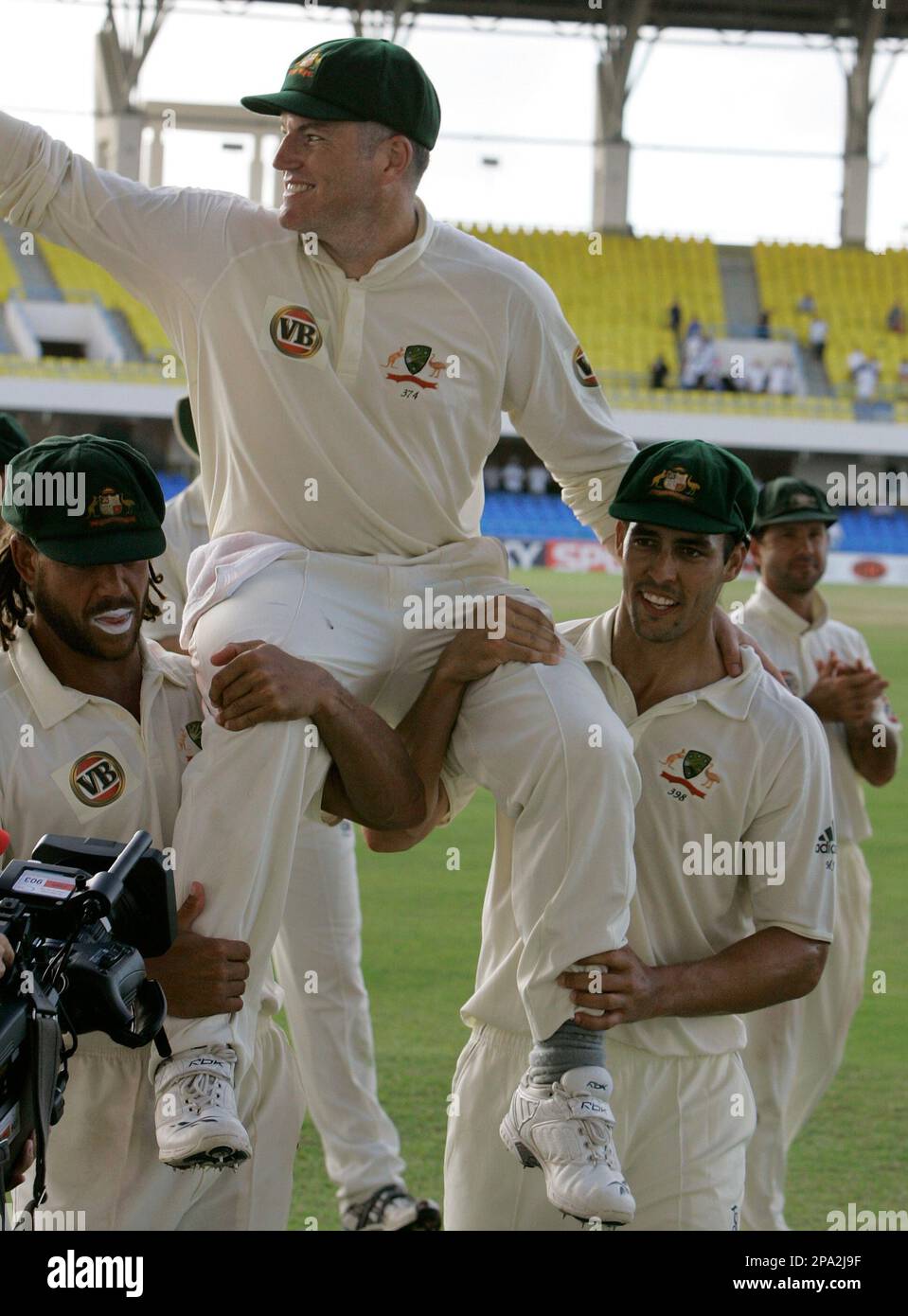 Australia's leg-spinner Stuart MacGill, center, gets hoisted onto the ...