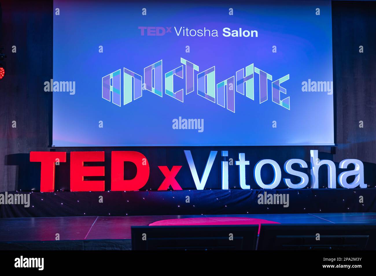 Circa 2023, Sofia, Bulgaria: The TEDxVitosha conference letters on the stage. Screen shows a ...