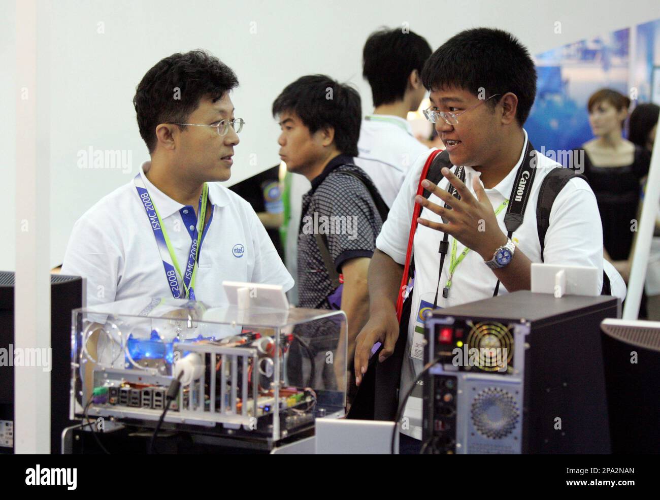 An employee of Intel Corporation explains details of their computer ...