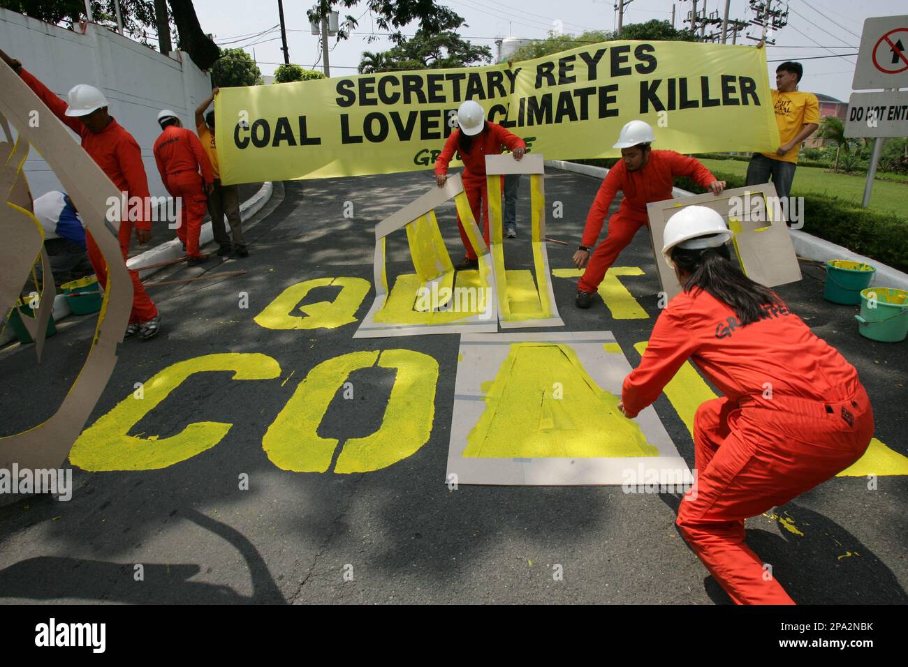 Activists from the environmentalist group Greenpeace reveal the words ...