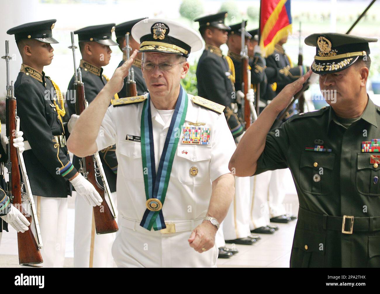 Philippine Brigadier Gen. Ireneo Espino, right, walks with Adm. Michael ...