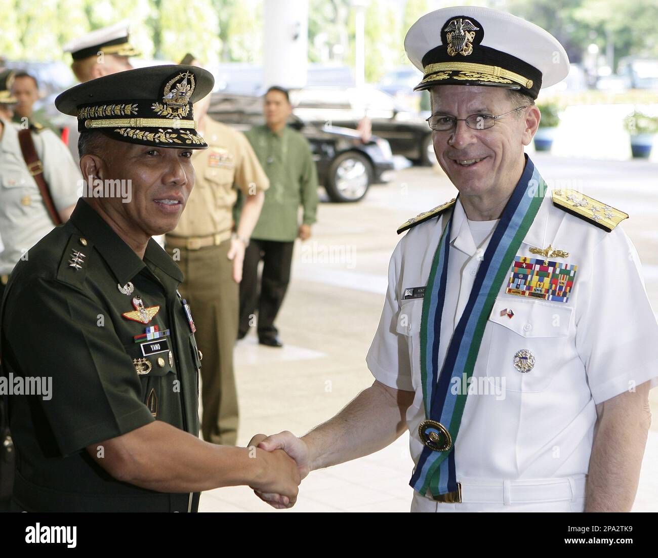 Philippine military chief Gen. Alexander Yano, left, greets Adm ...