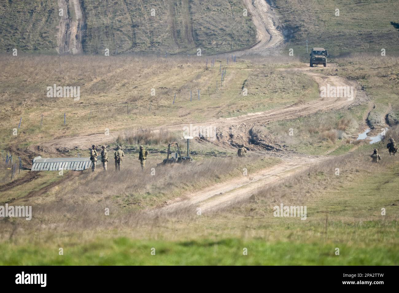 British army infantry soldiers make a temporary river bridge platform ...