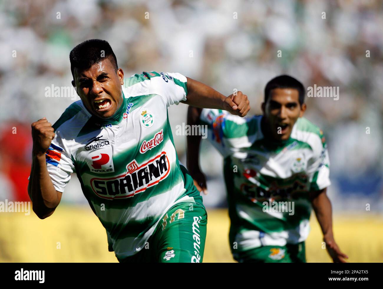 Santos' Emmanuel Ludena, left, from Argentina, followed by teammate ...