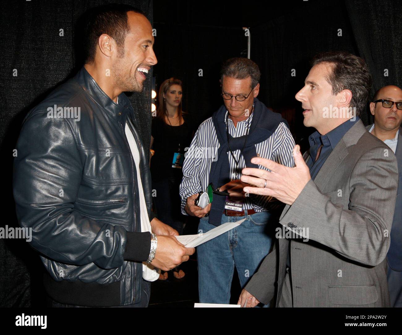 Dwayne 'The Rock' Johnson, left, and Steve Carell are seen backstage at ...