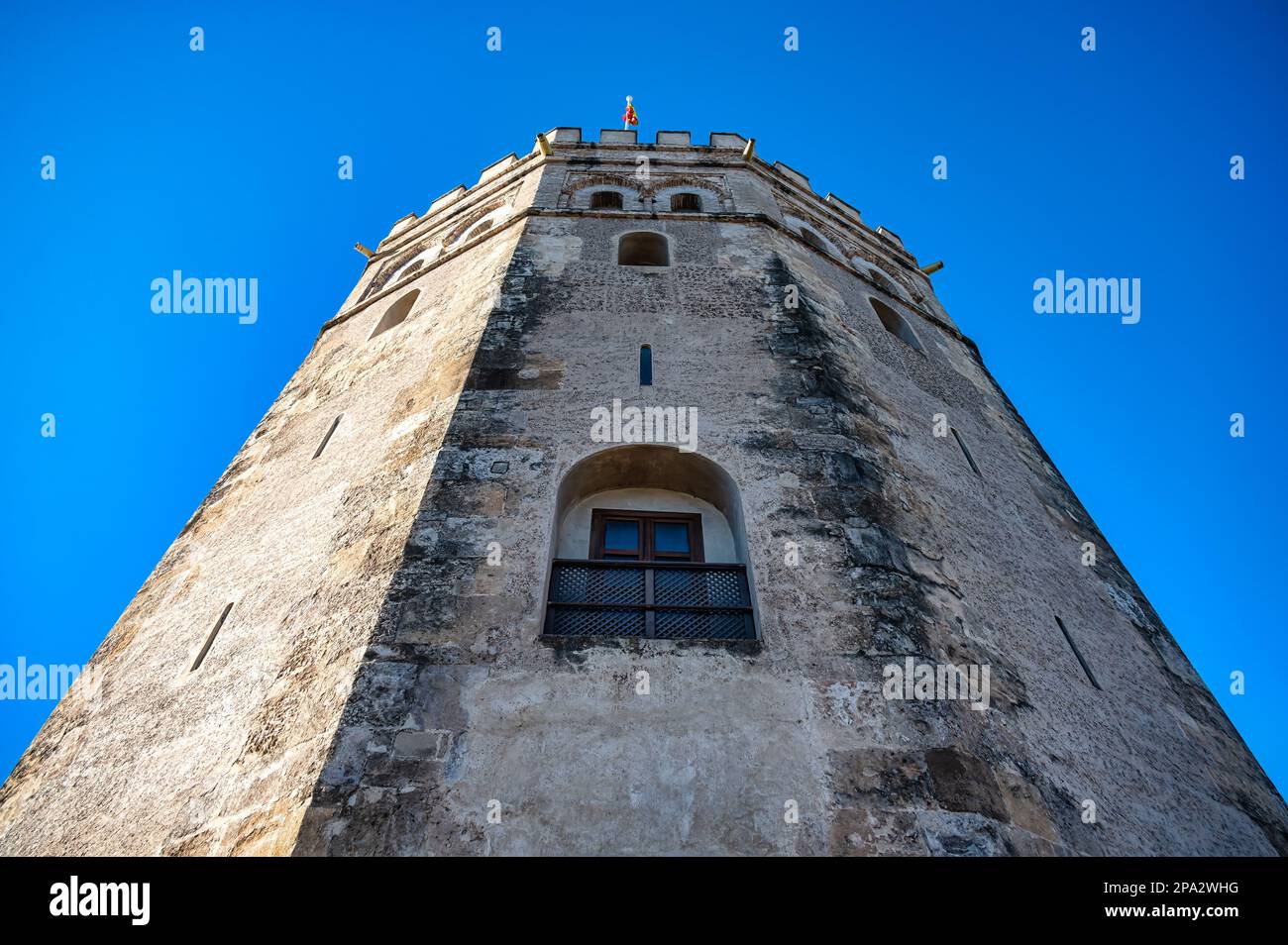 Colonial building exterior with blue sky. In Spanish, the building's ...