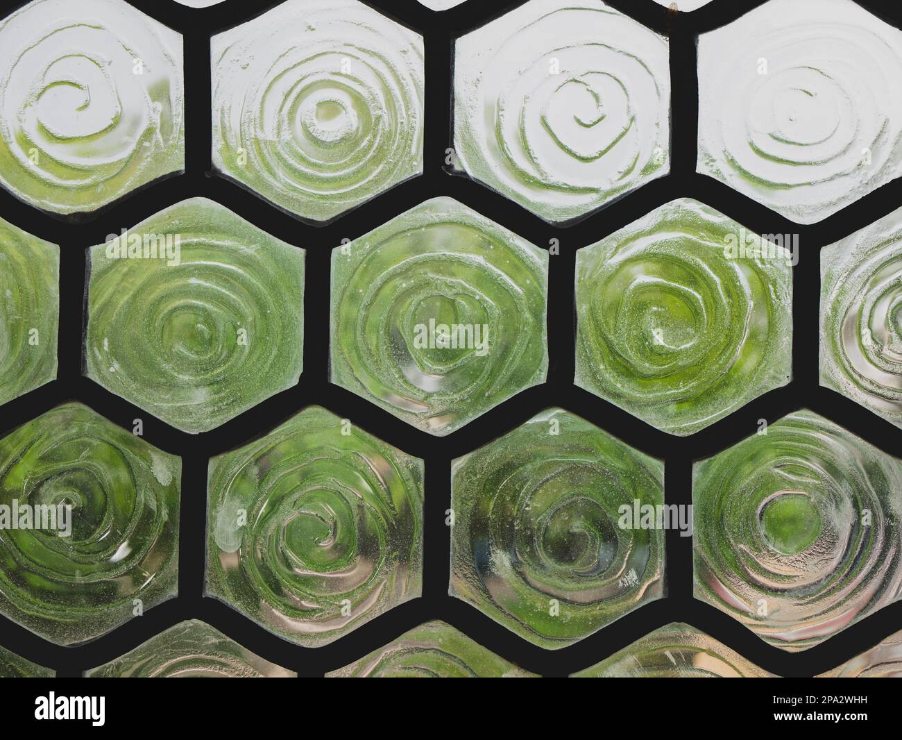 Stained-glass window with hexagon cells and corrugated frosted glass ...