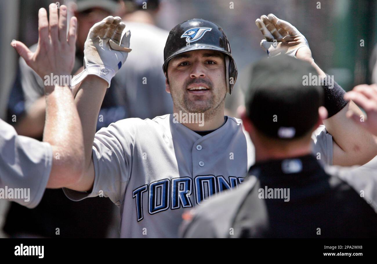 Toronto Blue Jays' Rod Barajas is congratulated after hitting a homer ...