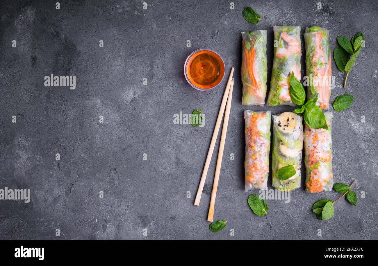 Fresh assorted spring rolls set background. Handmade asianChinese ...