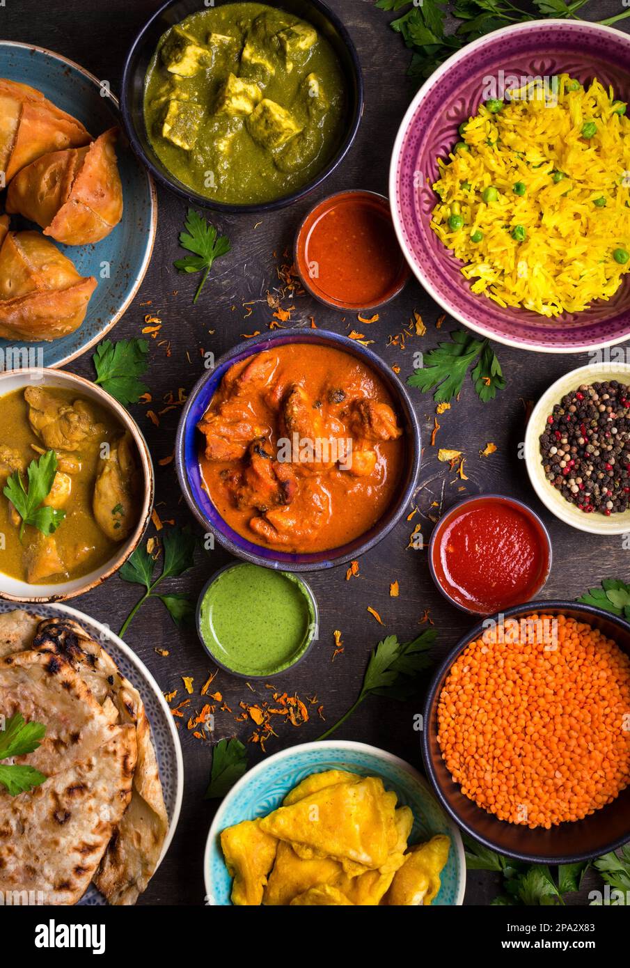Assorted indian food on dark wooden background. Dishes and appetizers ...