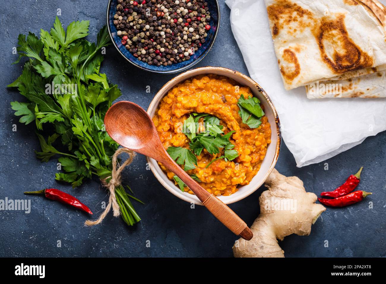 Traditional Indian lentils Dal, naan butter bread, fresh coriander ...