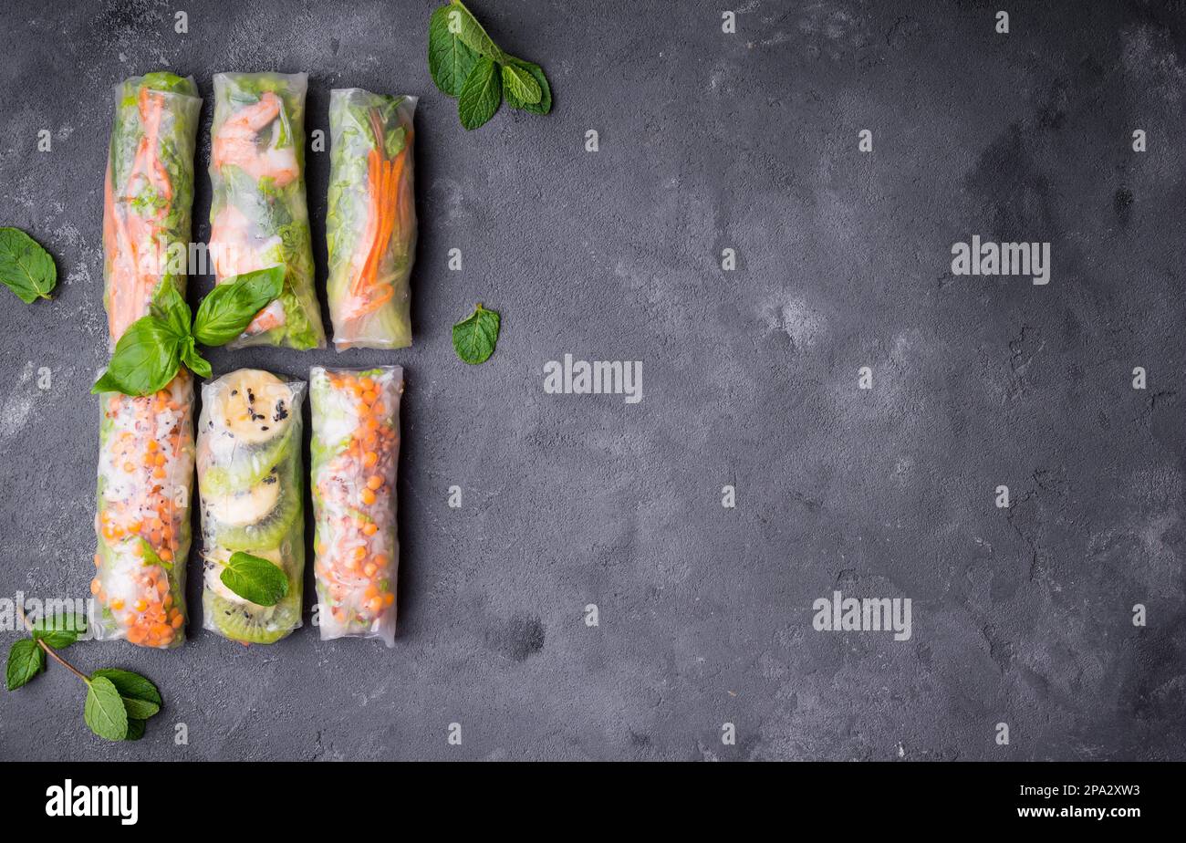 Fresh assorted spring rolls set background. Handmade asianChinese ...