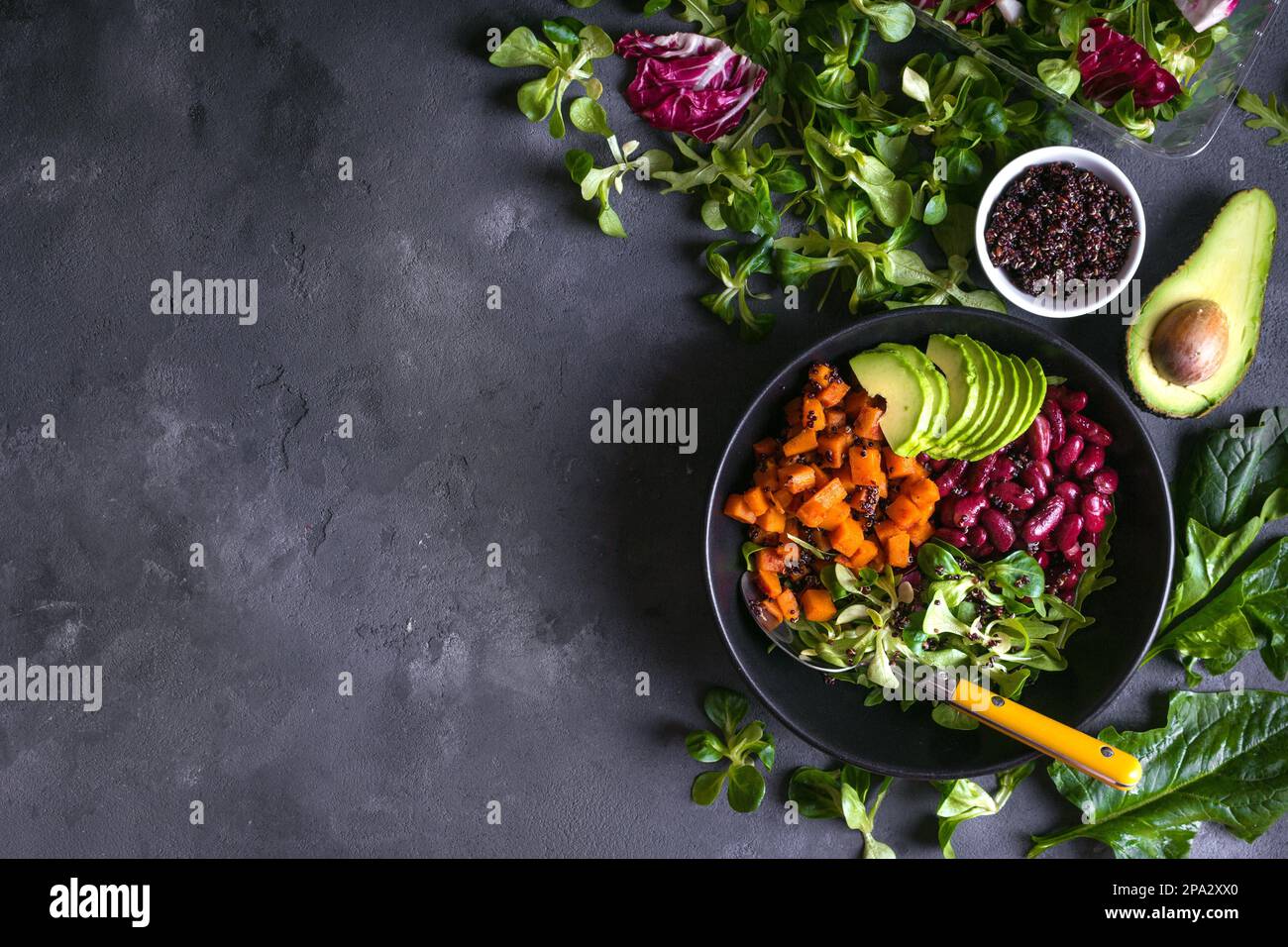 Fresh quinoa organic vegetables salad in bowl on concrete rustic ...