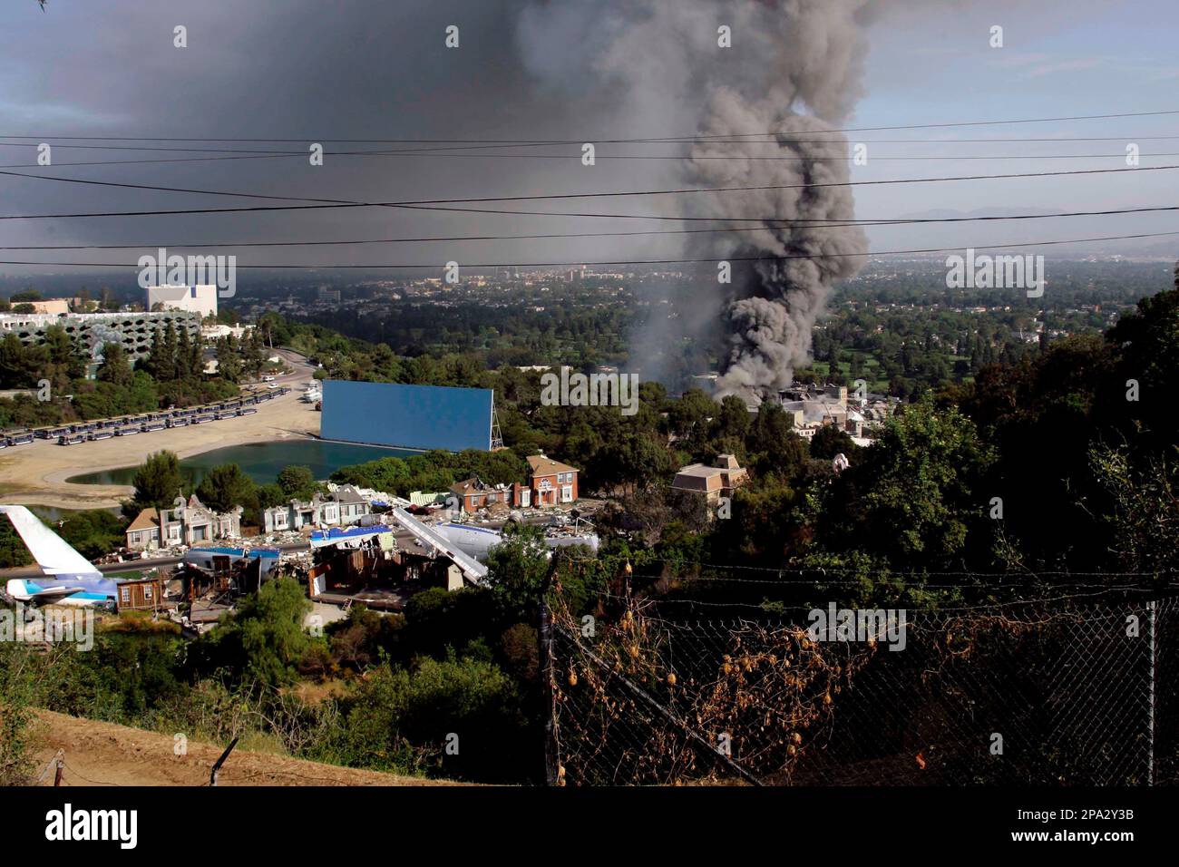 Plumes of smoke are seen at Universal Studios in Los Angeles Sunday ...