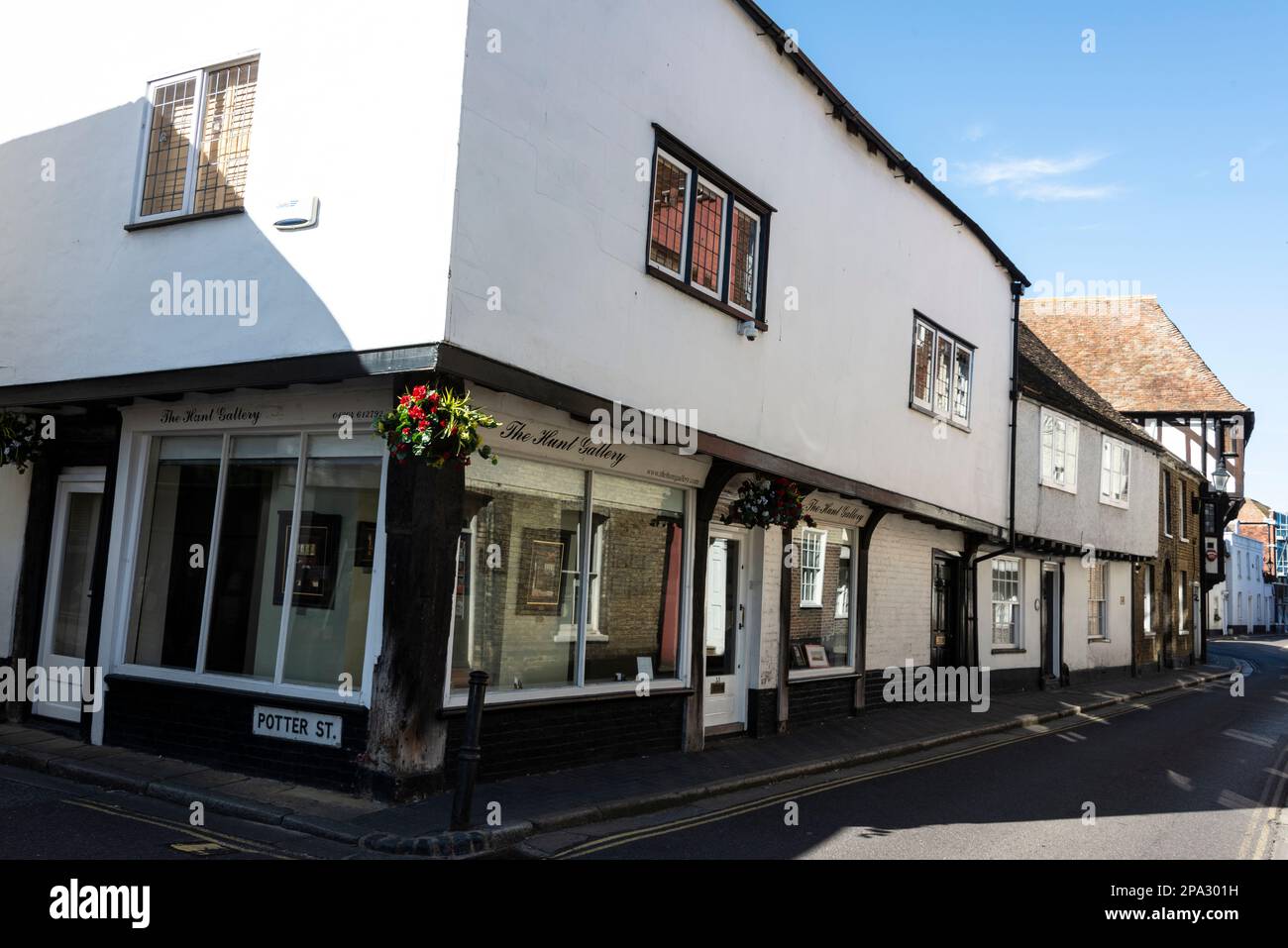 A row of medieval buildings on Strand Street in the historic town of ...