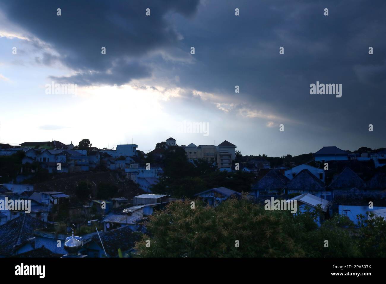 Malang, East Java, Indonesia. 11th Mar, 2023. Black clouds cover on ...