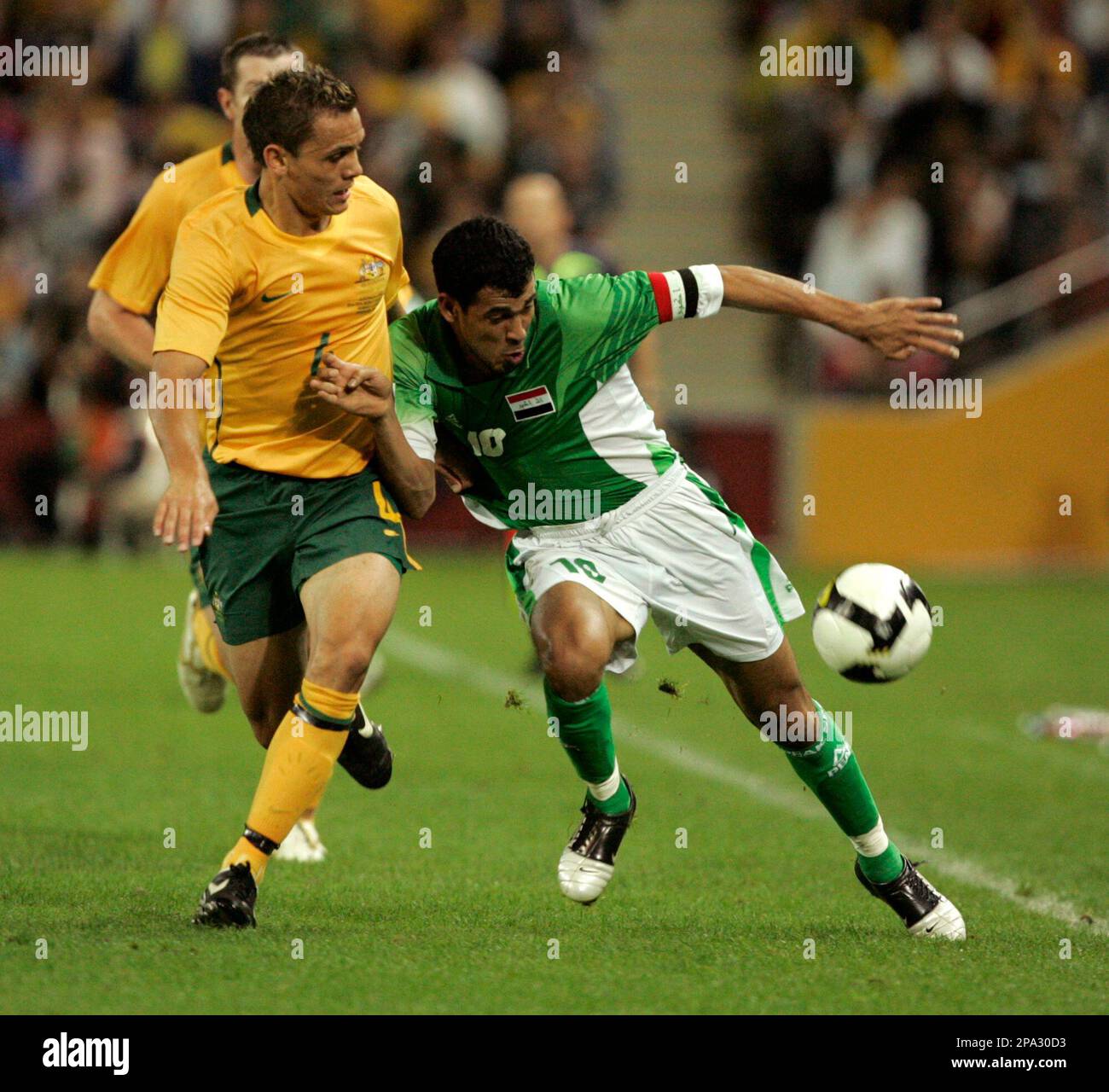 Australia's Carl Valeri, left, and Iraq's Younes Khalef (10) in action ...