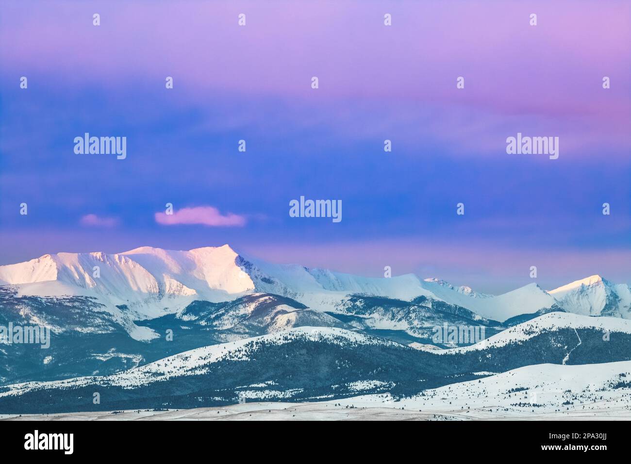 first light on mount haggin in the anaconda range in winter near ...
