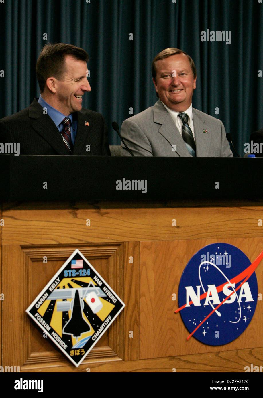 LeRoy Cain, chairman of the Mission Management Team, left, and Mike ...