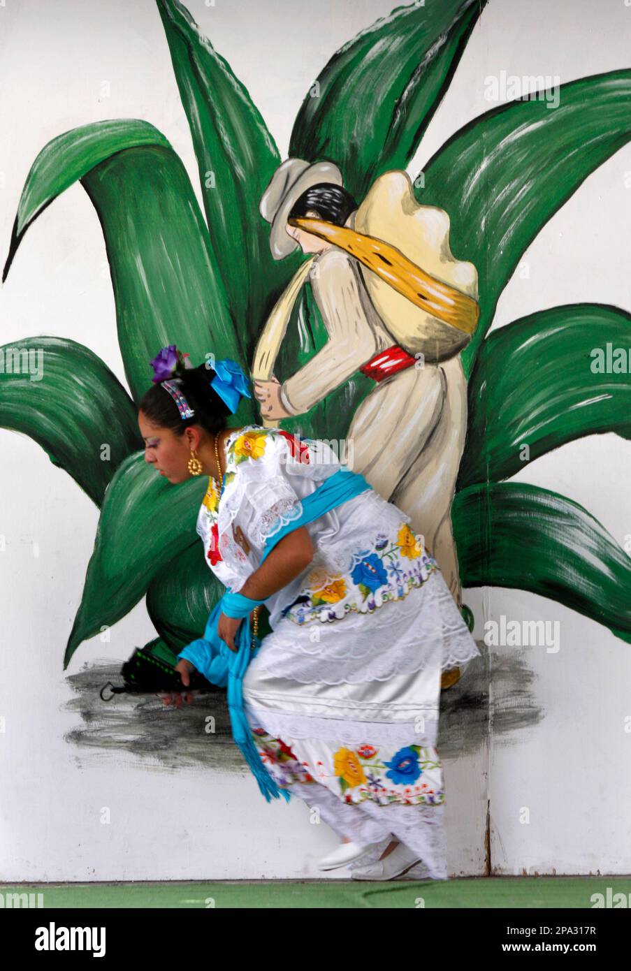A dancer performs during the Pulque festival in Mexico City, Saturday ...