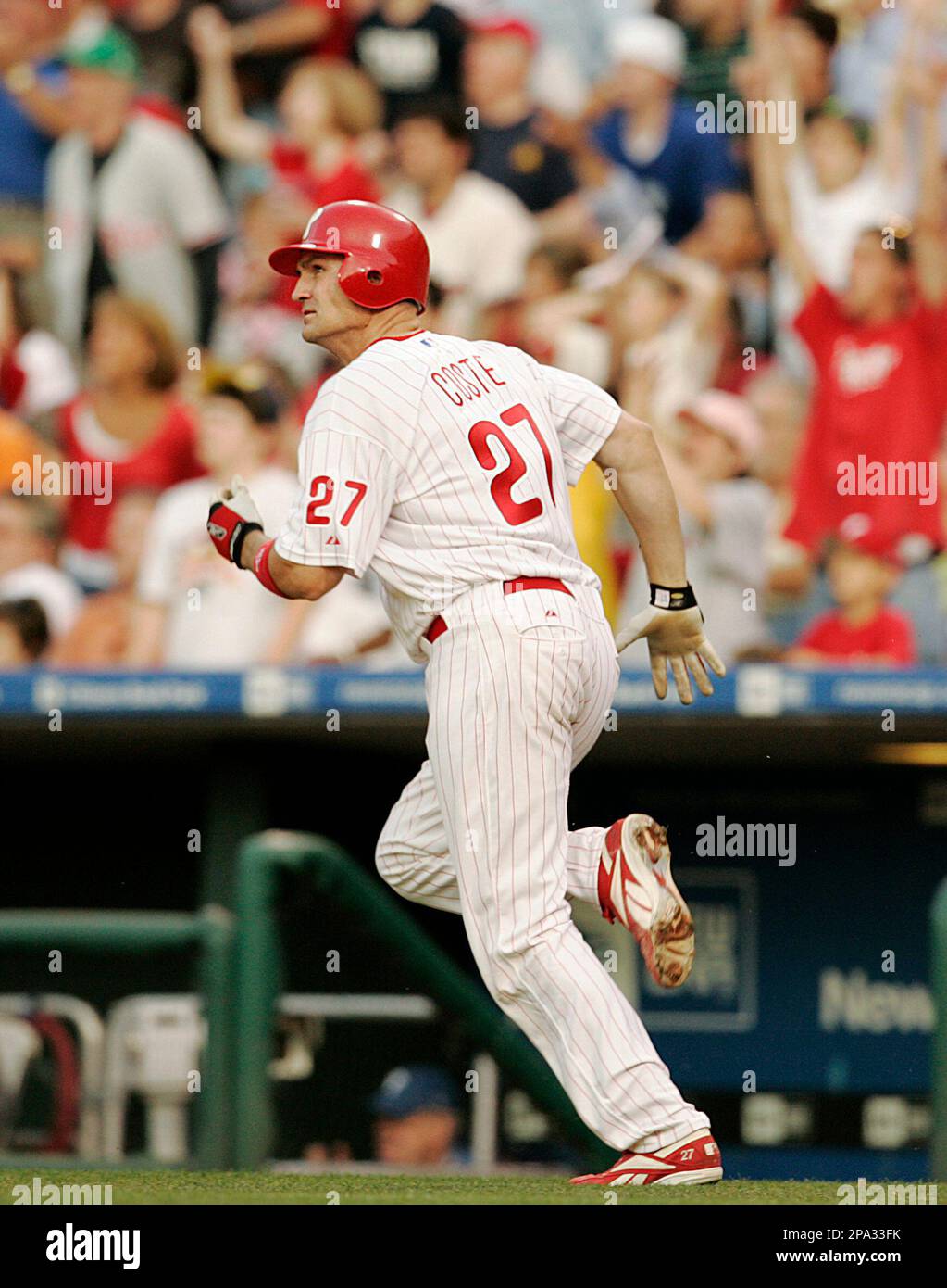 Philadelphia Phillies' Chris Coste eyes his three-run homer as he ...