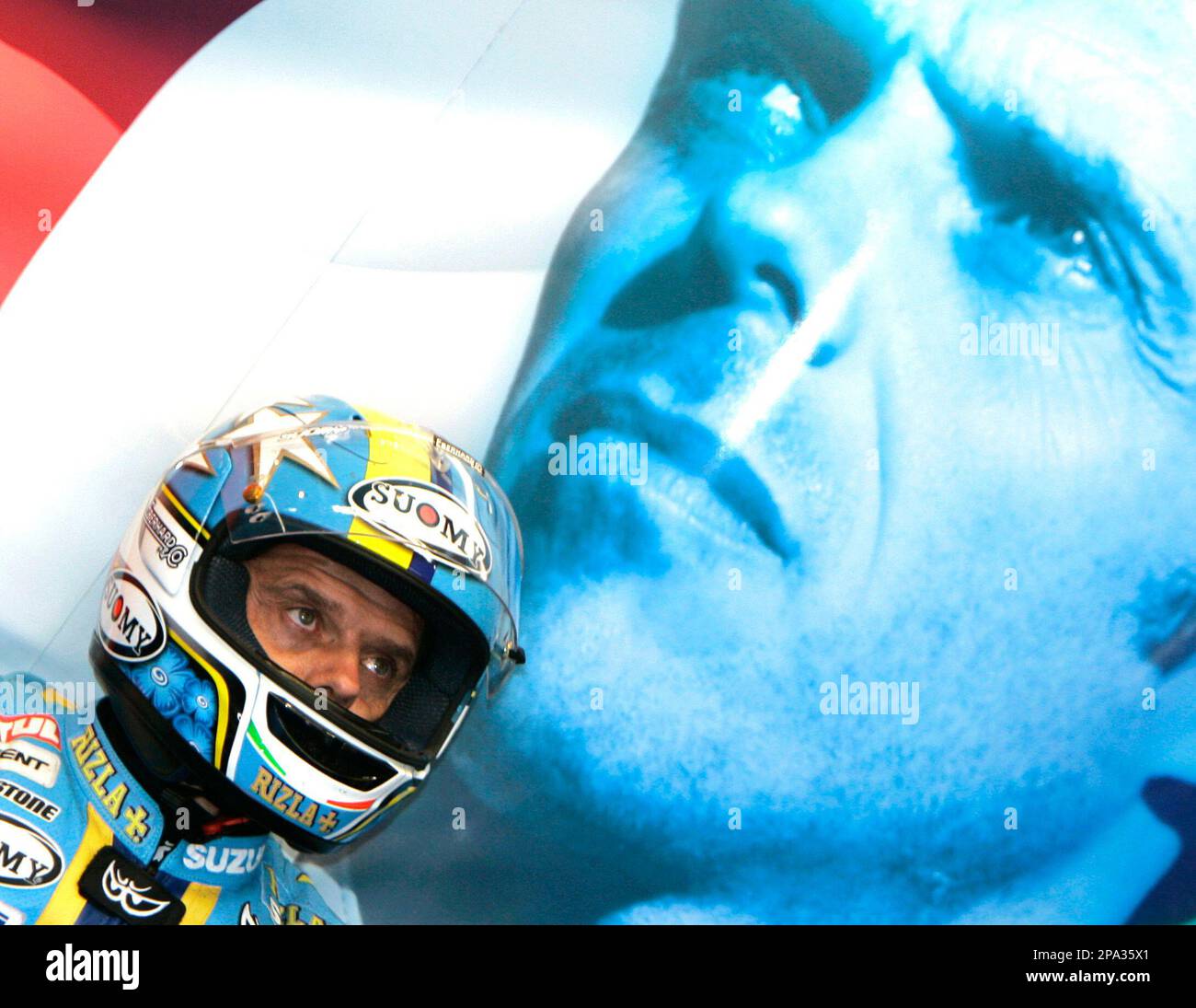 Suzuki driver Loris Capirossi of Italy looks on during the free ...