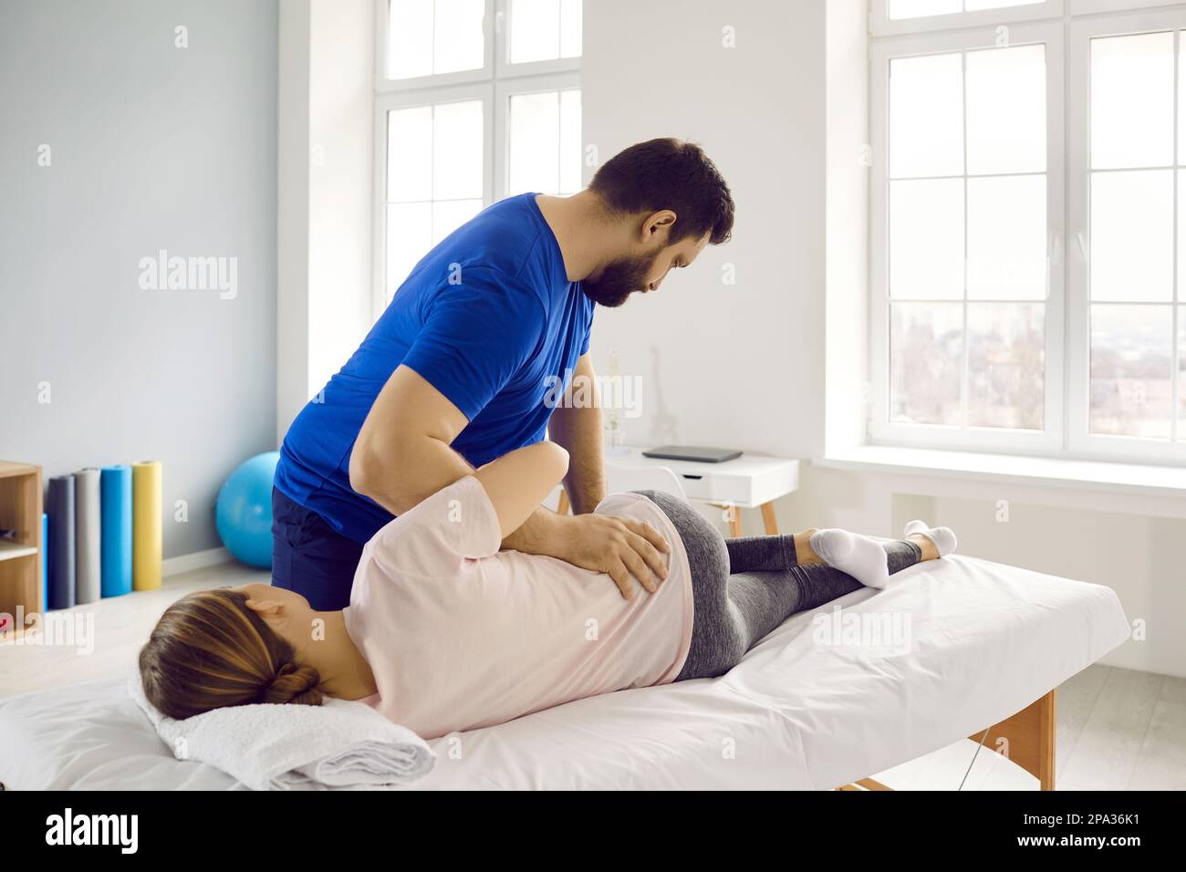 Physiotherapist, chiropractor, osteopath, or manual therapist treating ...