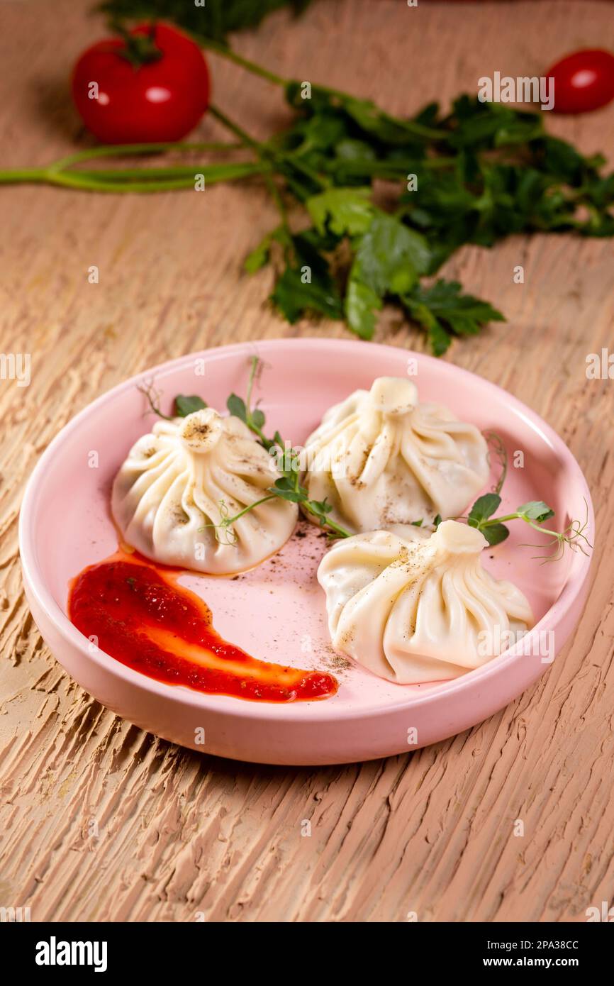 Traditional georgian khinkali cooked in hi-res stock photography and ...