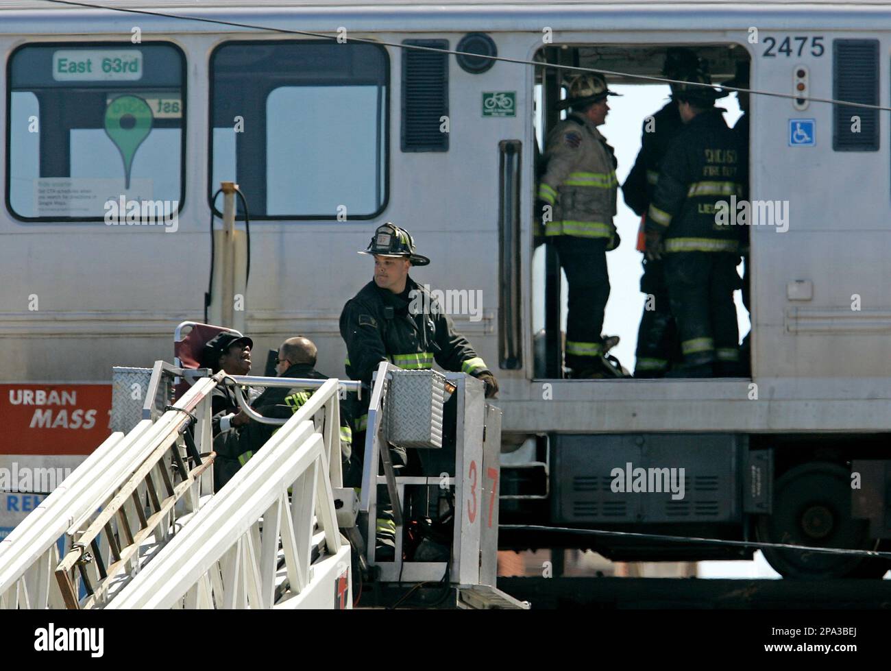 Chicago Fire Department personnel evacuate a passenger from a Chicago ...