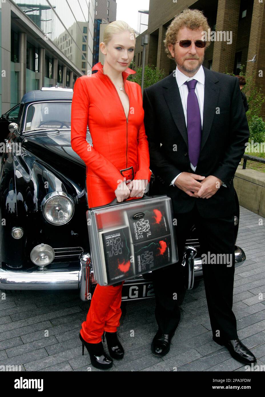 Model Tuuli Shipster holds a briefcase with copies of the new James ...