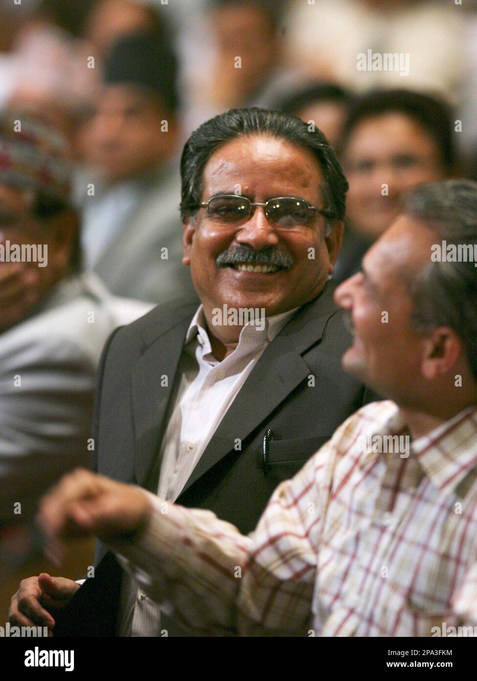 Maoist leader Prachanda is all smiles as he arrives for the oath taking ...