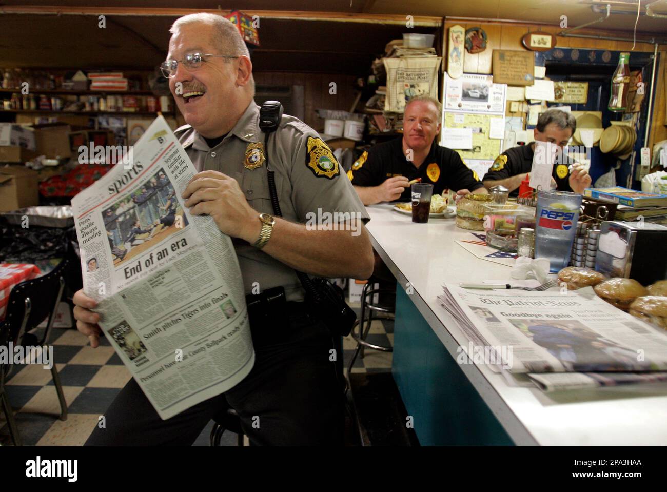 Hollidaysburg, police Chief Jeff Ketner, left, laughs with Sgt. David ...