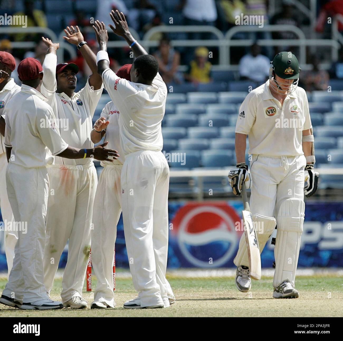 Australia's batsman Brett Lee, right, walks off the pitch while West ...